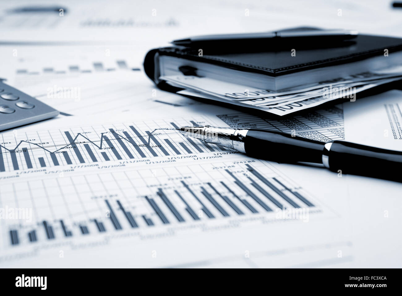 financial charts and graphs on the table Stock Photo - Alamy
