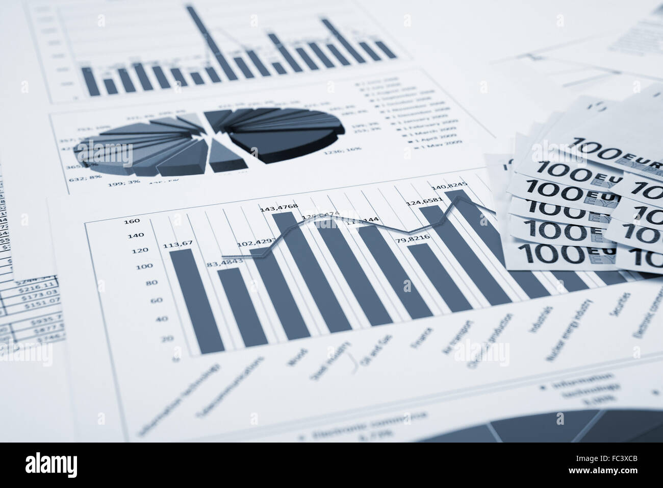 financial charts and graphs on the table Stock Photo - Alamy