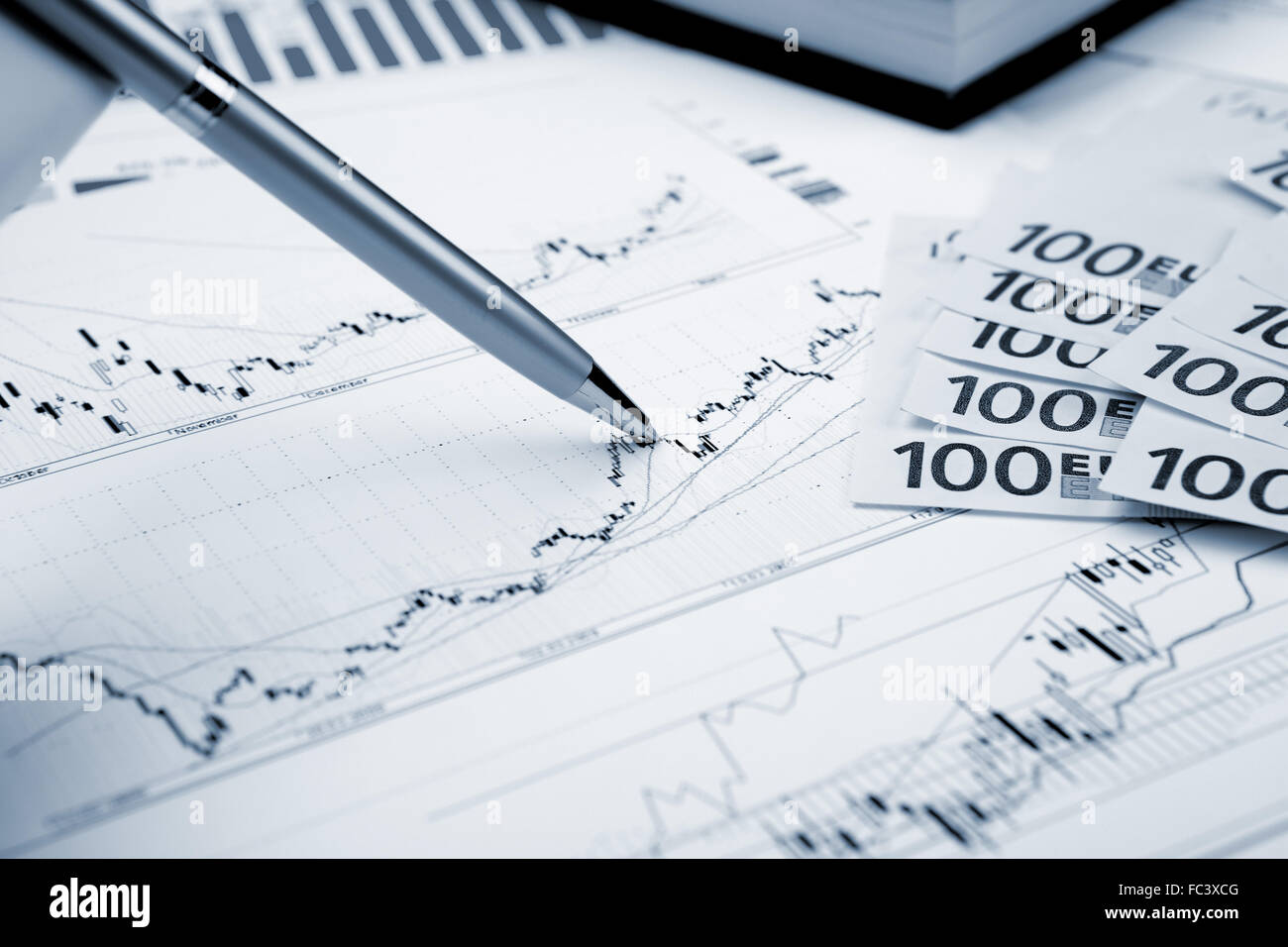 financial charts and graphs on the table Stock Photo - Alamy