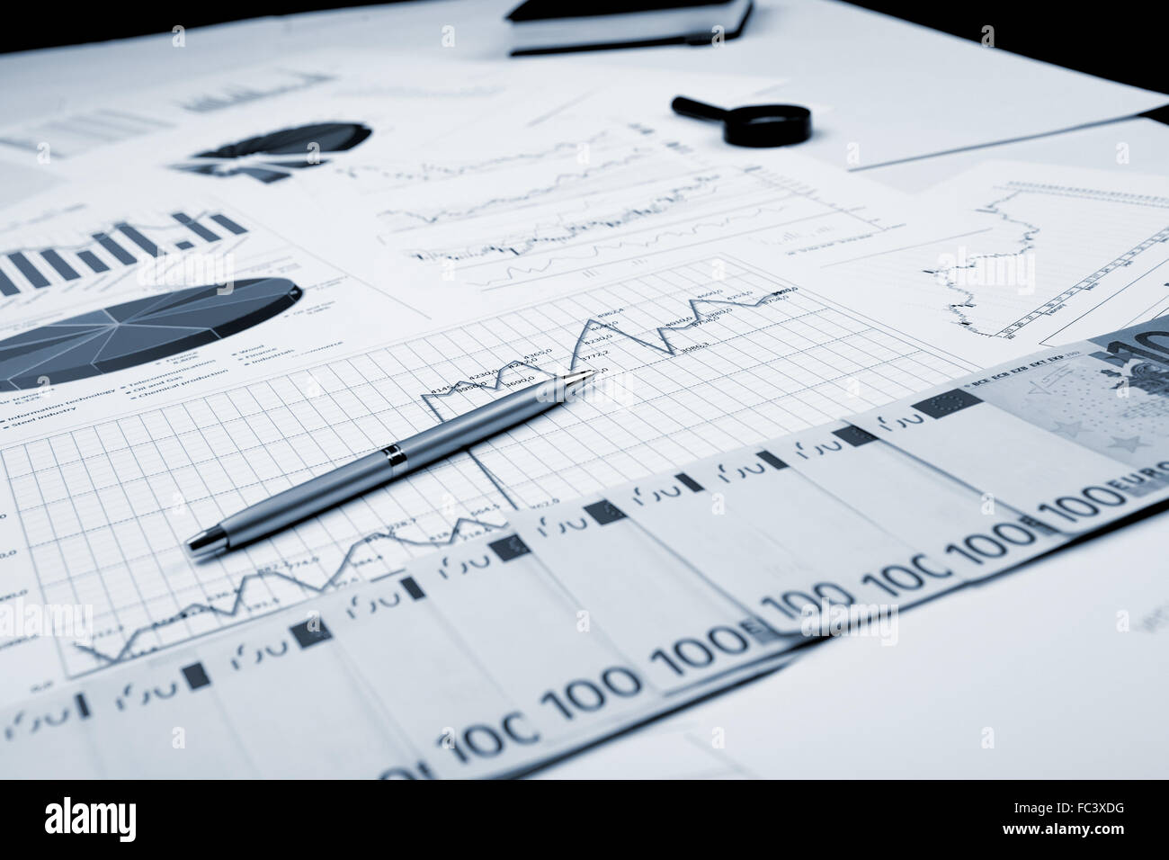 financial charts and graphs on the table Stock Photo - Alamy
