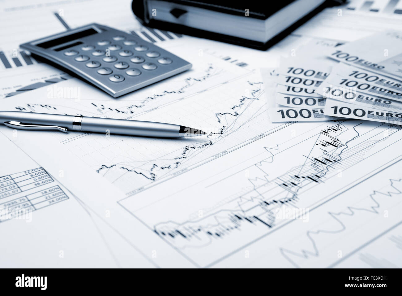 financial charts and graphs on the table Stock Photo - Alamy