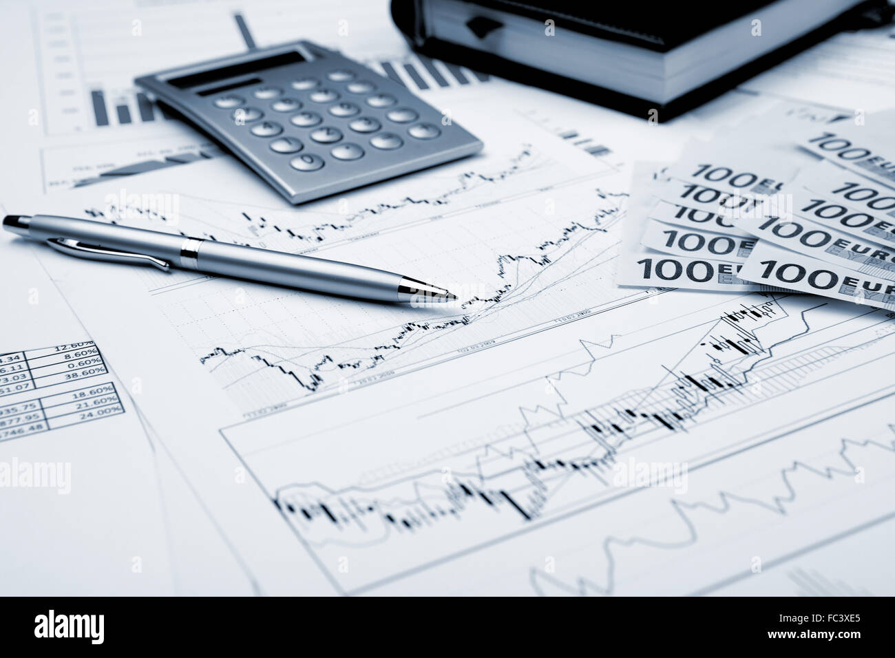 financial charts and graphs on the table Stock Photo - Alamy