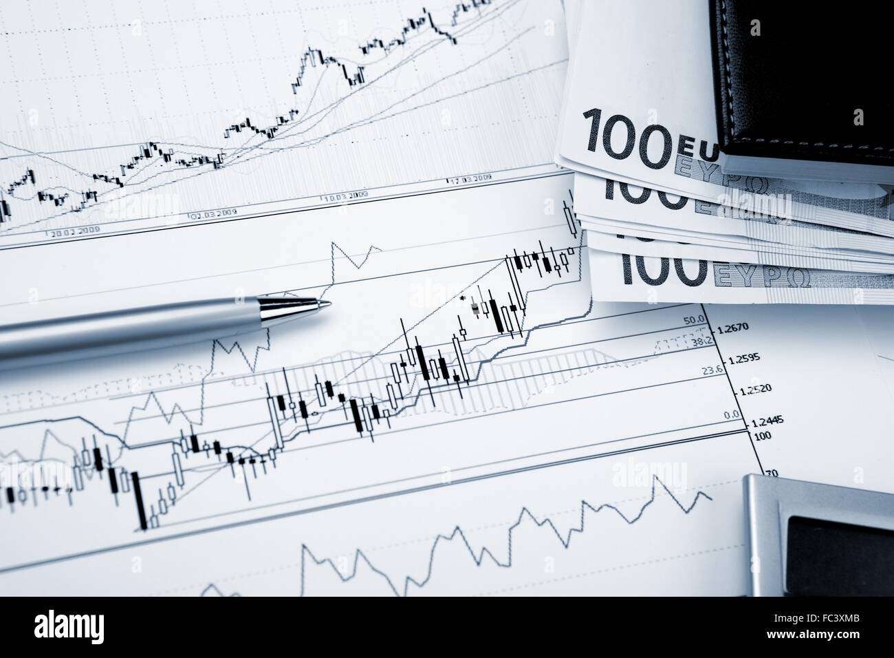 financial charts and graphs on the table Stock Photo - Alamy