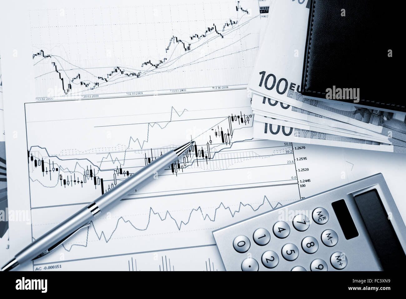 financial charts and graphs on the table Stock Photo - Alamy