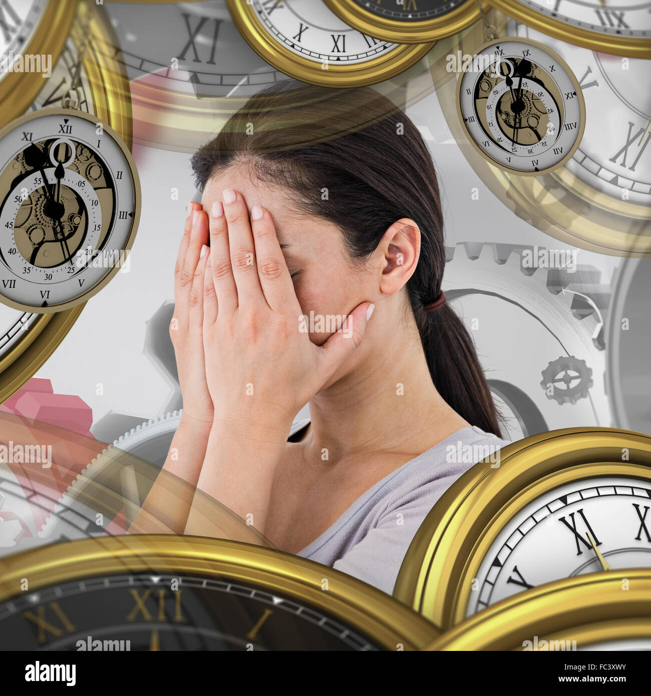 Composite image of sad brunette hiding her face Stock Photo - Alamy
