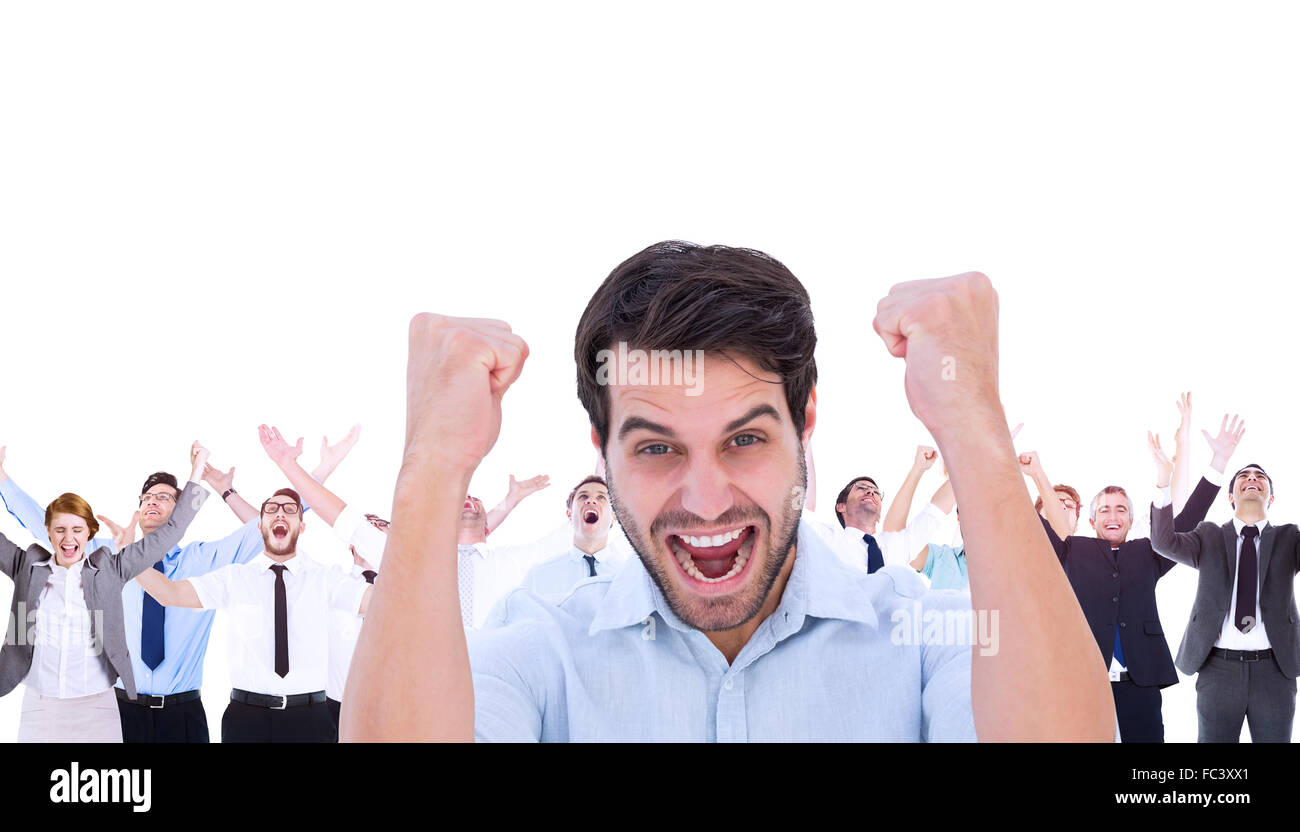 Composite image of cheering man looking at camera Stock Photo - Alamy
