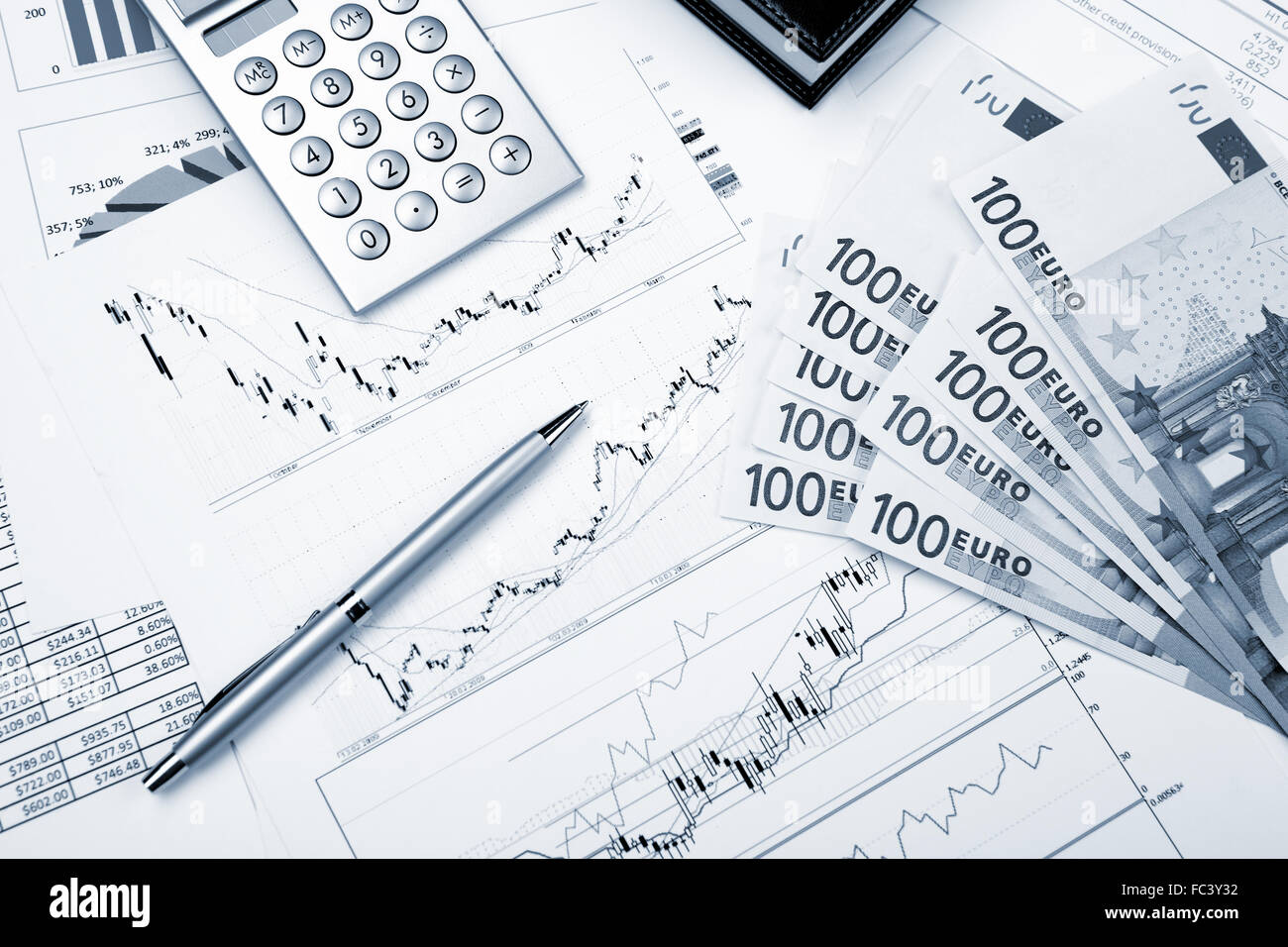 financial charts and graphs on the table Stock Photo - Alamy