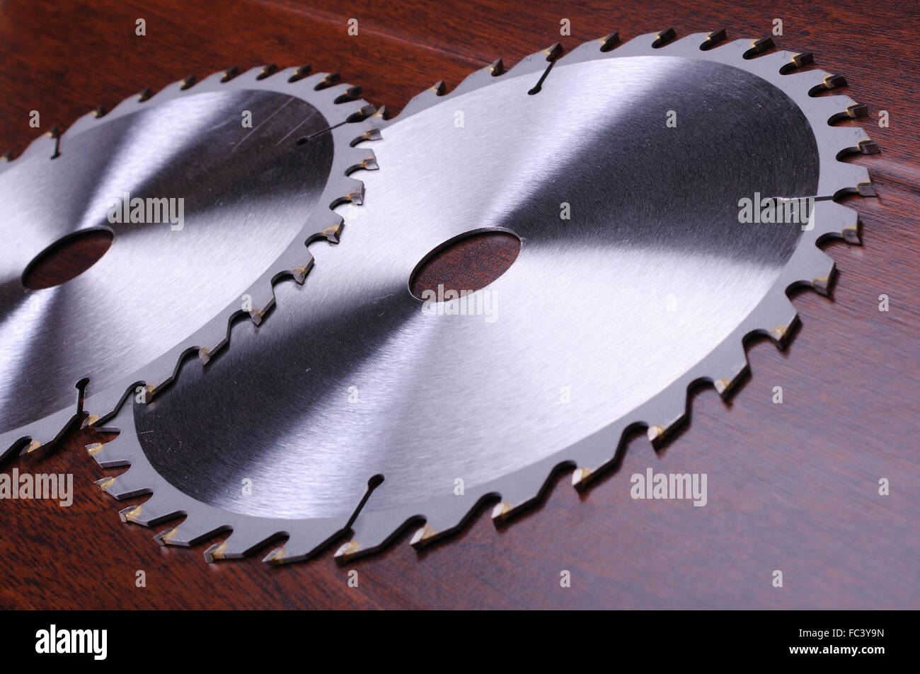 The metal disc is a circular saw on a dark background Stock Photo - Alamy
