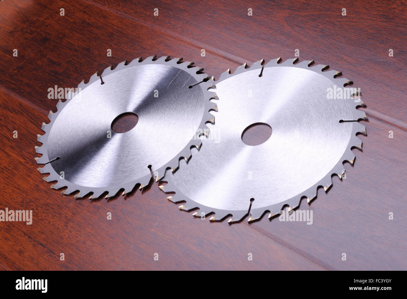 The metal disc is a circular saw on a dark background Stock Photo - Alamy