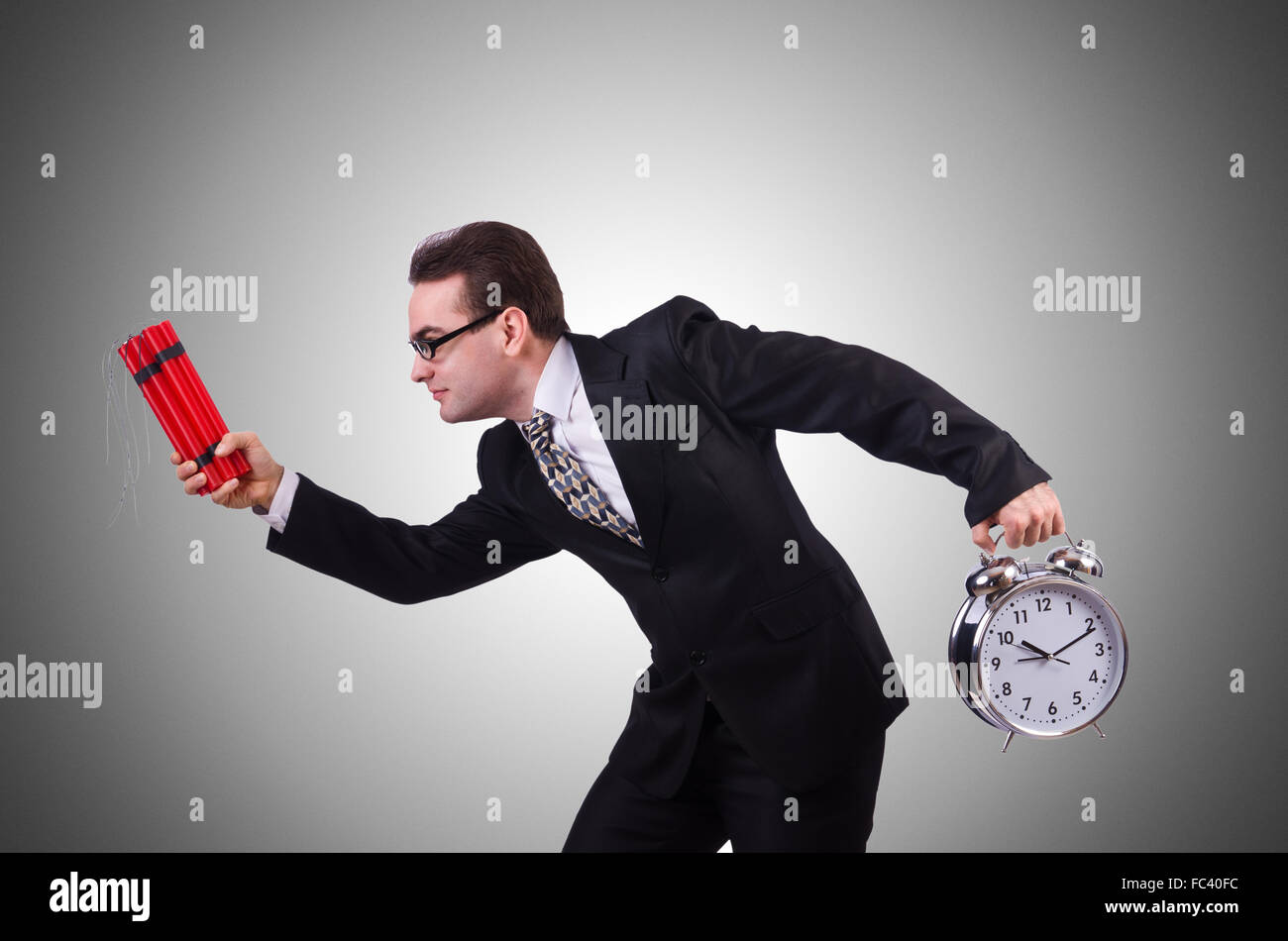 Man with time bomb against the gradient Stock Photo - Alamy