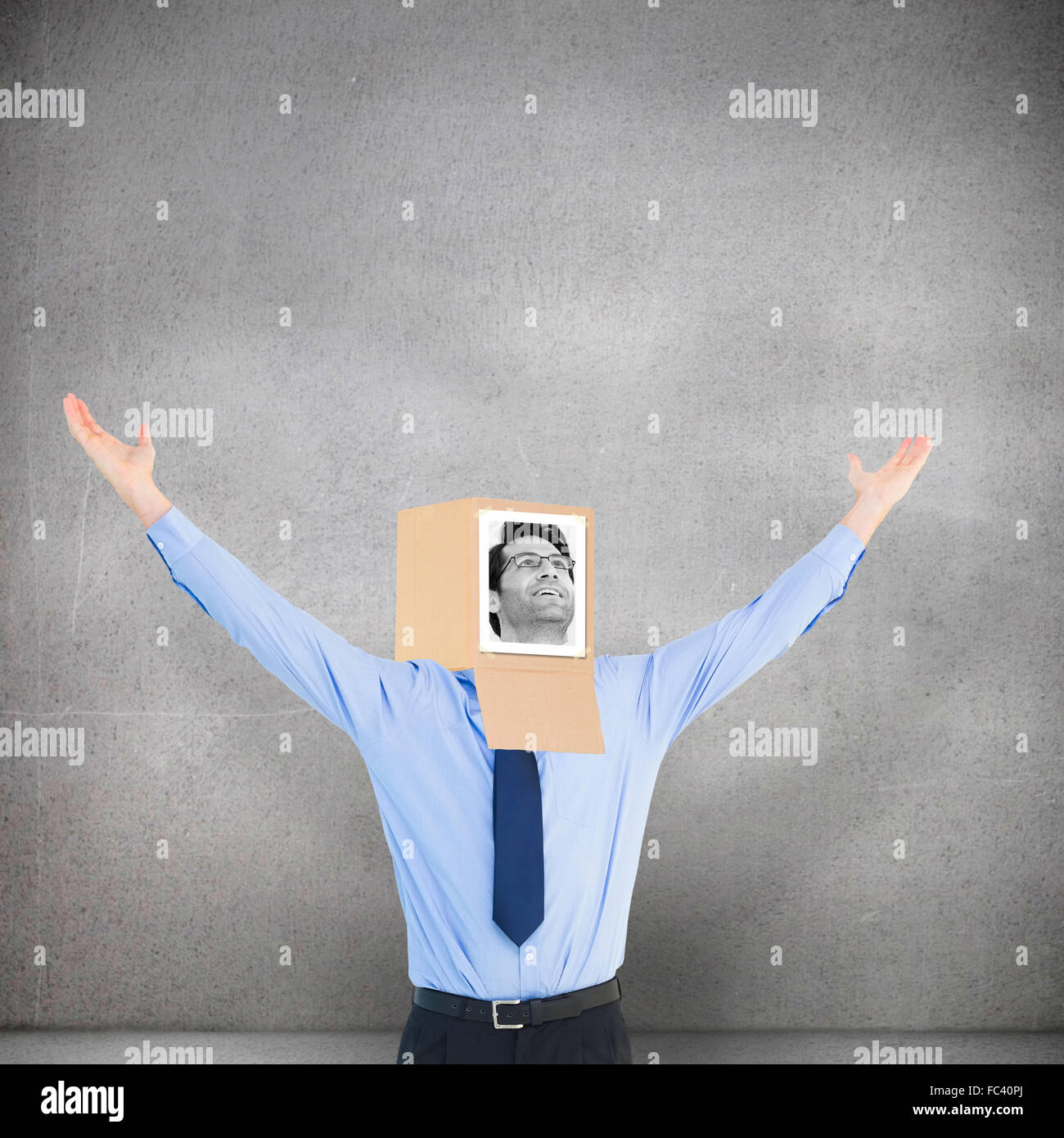 Composite image of businessman with photo box on head Stock Photo - Alamy