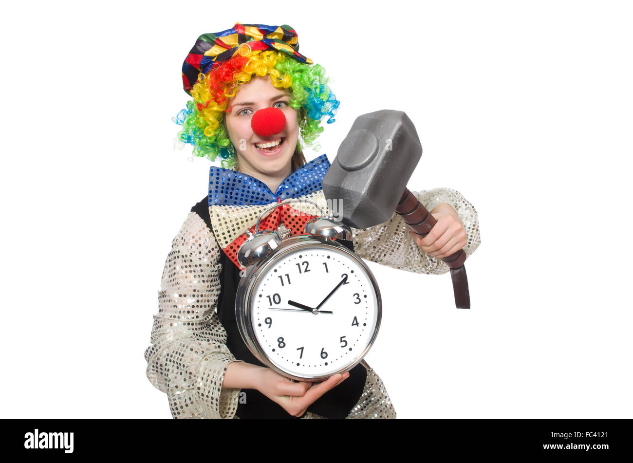 Female clown with alarm-clock and hammer isolated on white Stock Photo ...