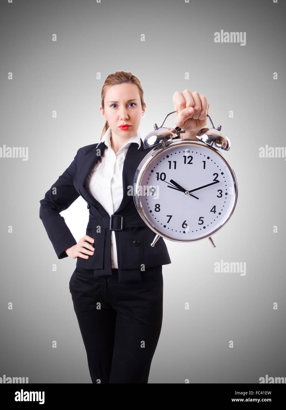 Woman businesswoman with giant clock Stock Photo - Alamy Woman businesswoman with giant clock Stock Photo - Alamy