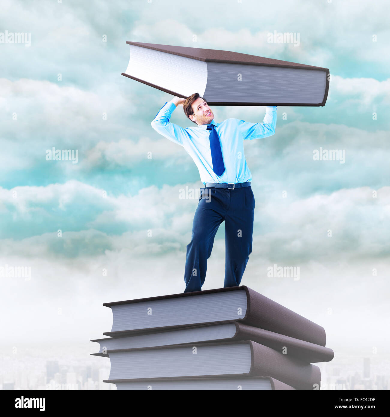 Composite image of focused businessman lifting up something heavy Stock ...