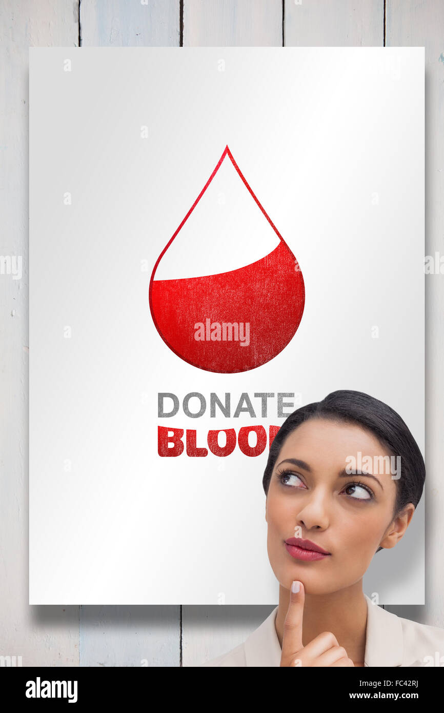 Composite image of smiling businesswoman thinking Stock Photo - Alamy