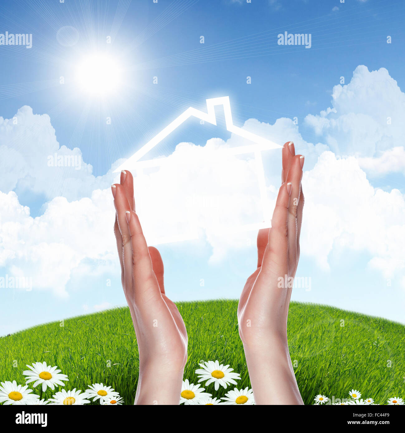 Human hand against blue sky background and house Stock Photo - Alamy