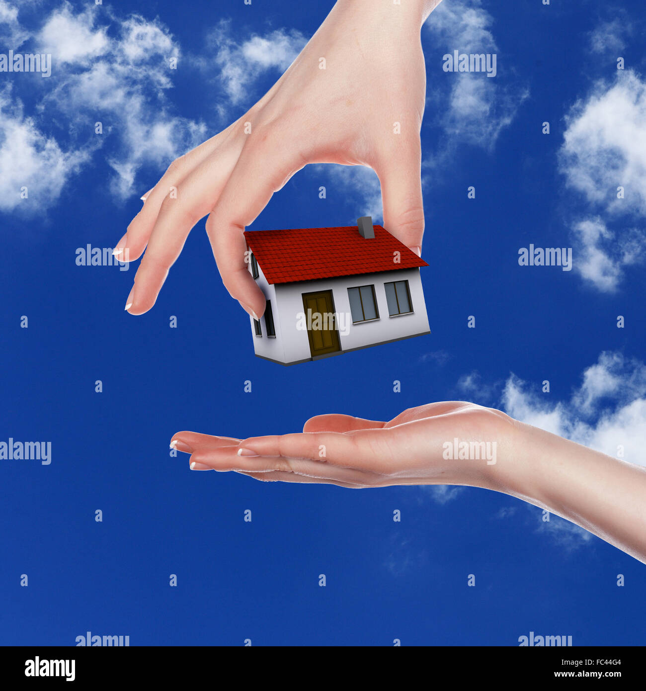 Human hand against blue sky background and house Stock Photo - Alamy