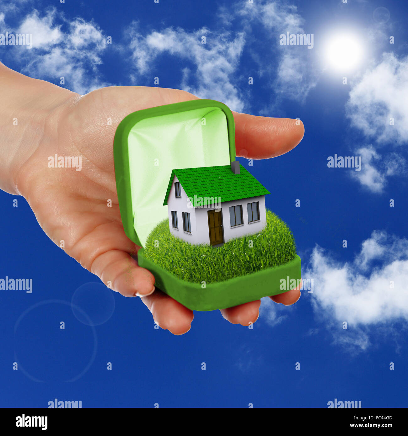 Human hand against blue sky background and house Stock Photo - Alamy