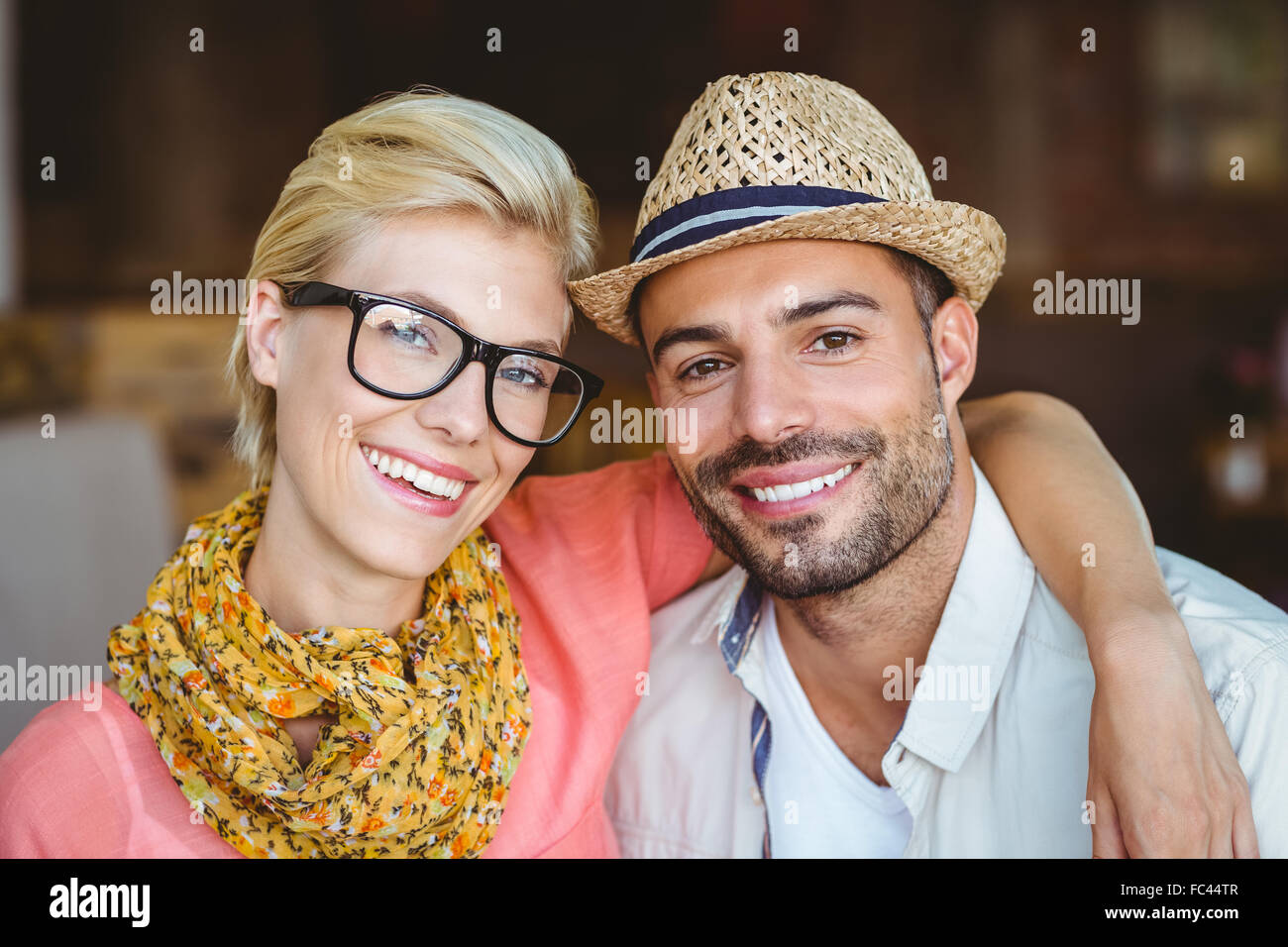 Cute couple on a date looking at the camera Stock Photo - Alamy