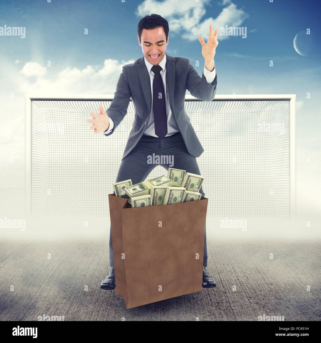 Composite image of screaming businessman catching Stock Photo - Alamy