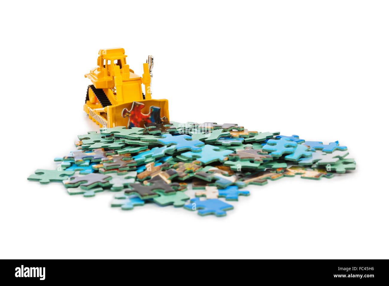 Toy bulldozer and puzzle Stock Photo - Alamy