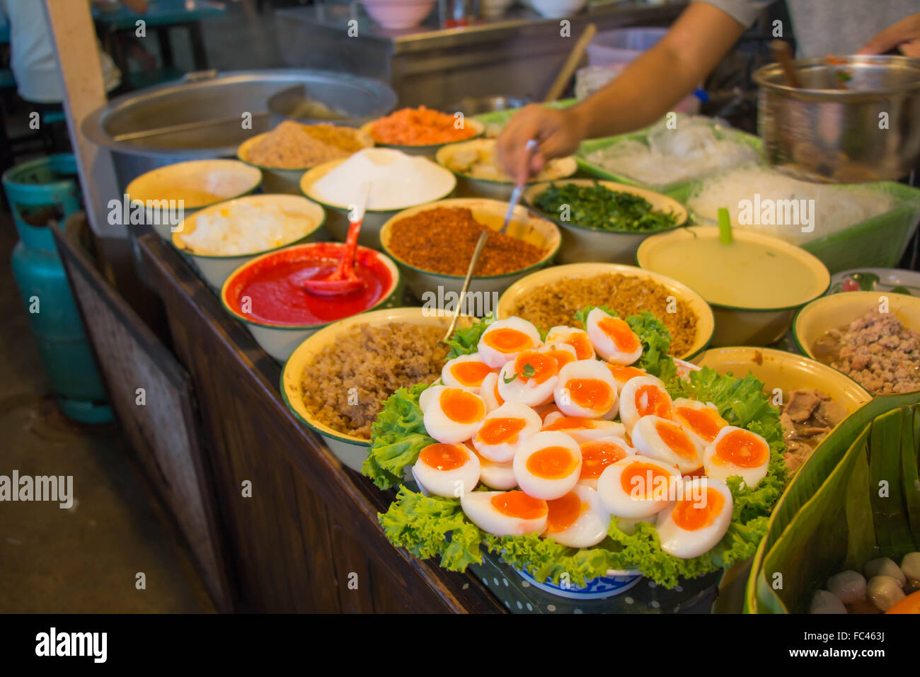 noodle shop in the market Thailand with seasoning display Stock Photo ...