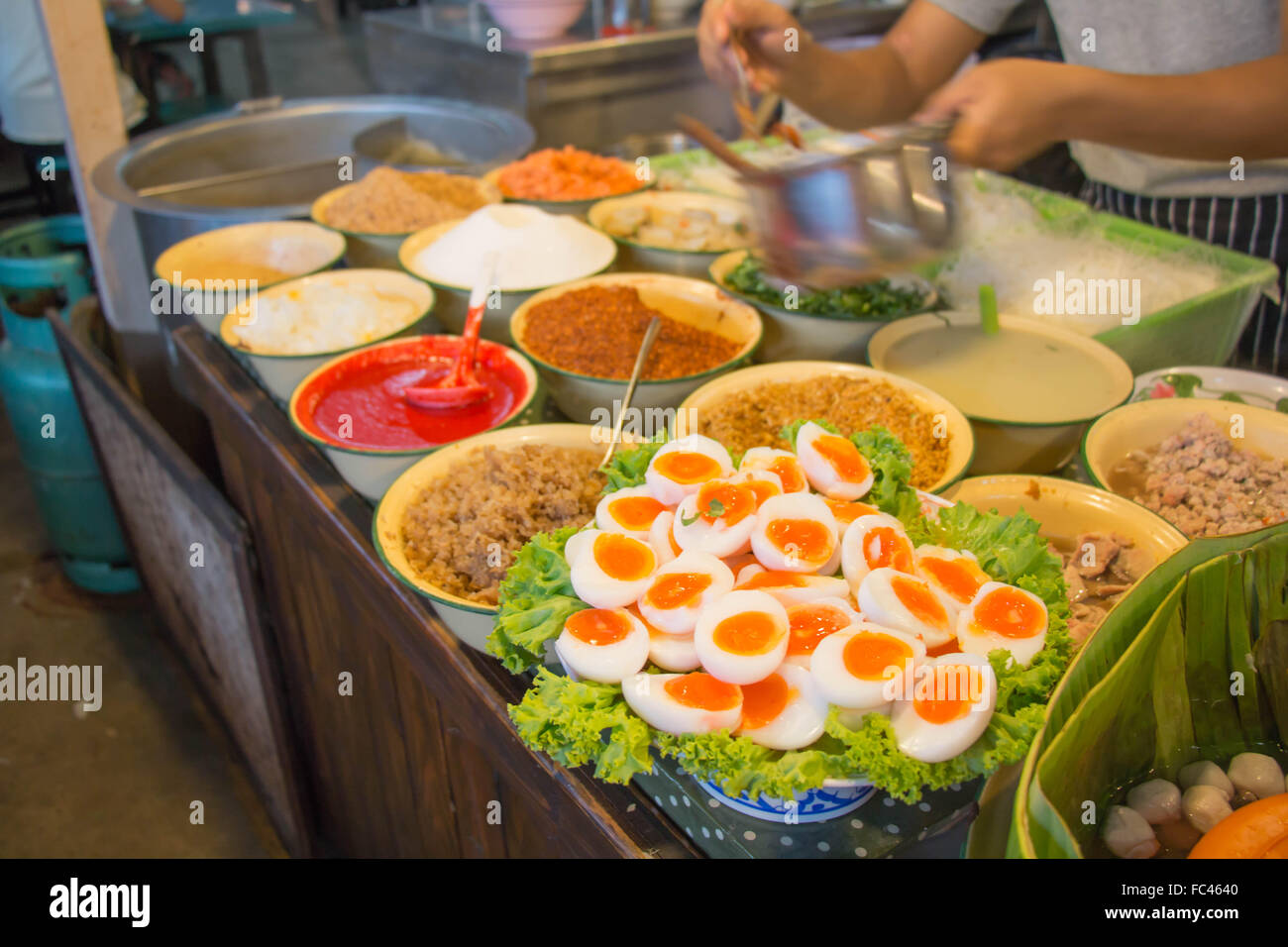 noodle shop in the market Thailand with seasoning display Stock Photo ...