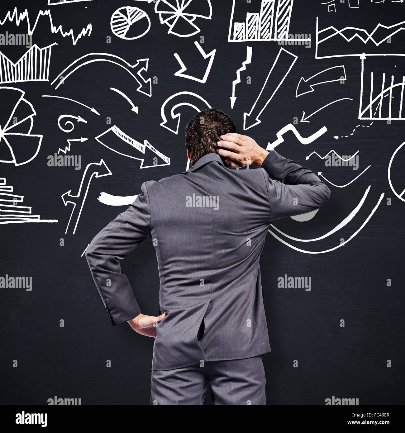 Composite image of thinking businessman scratching head Stock Photo - Alamy