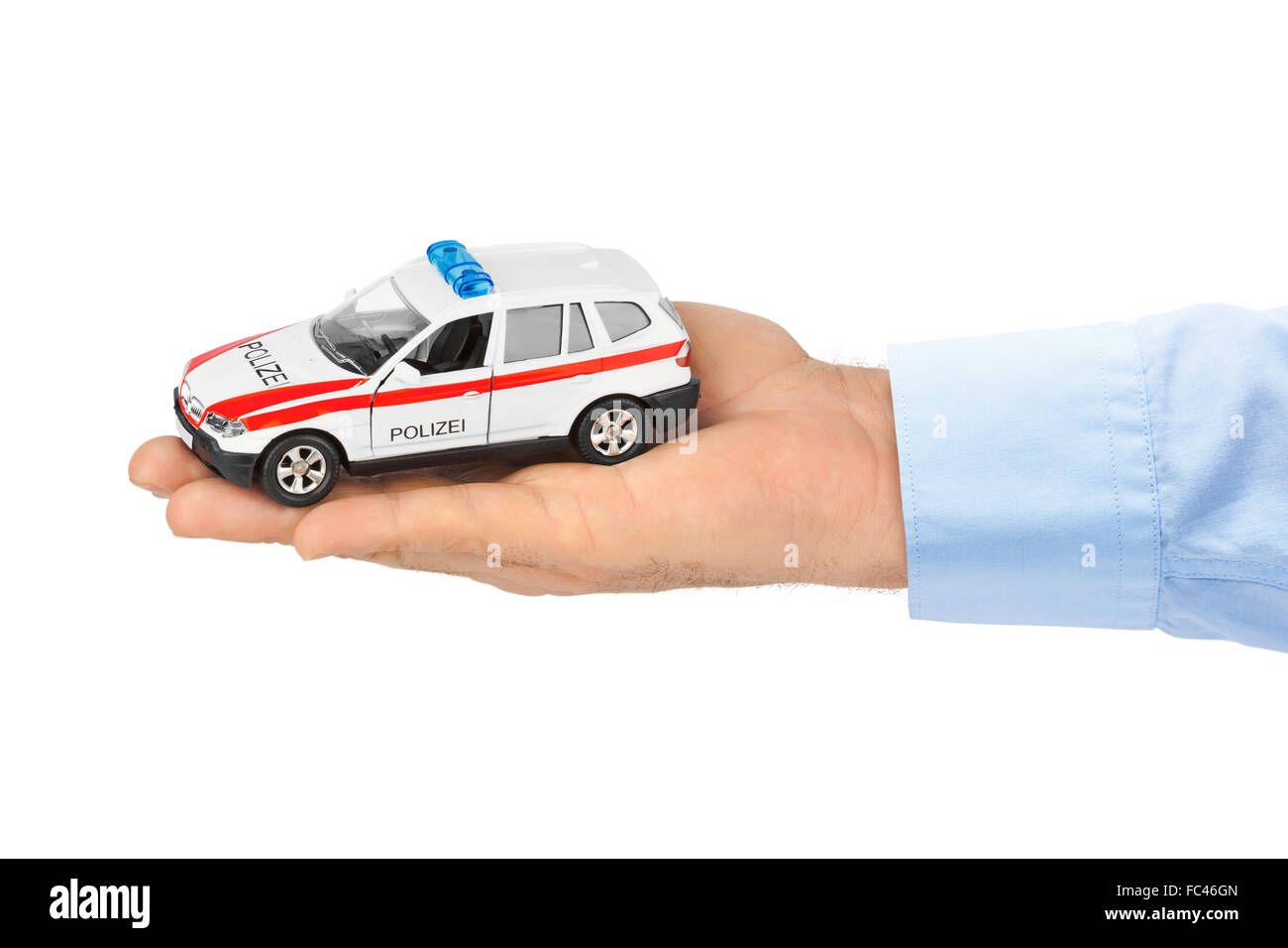Hand with toy police car Stock Photo - Alamy