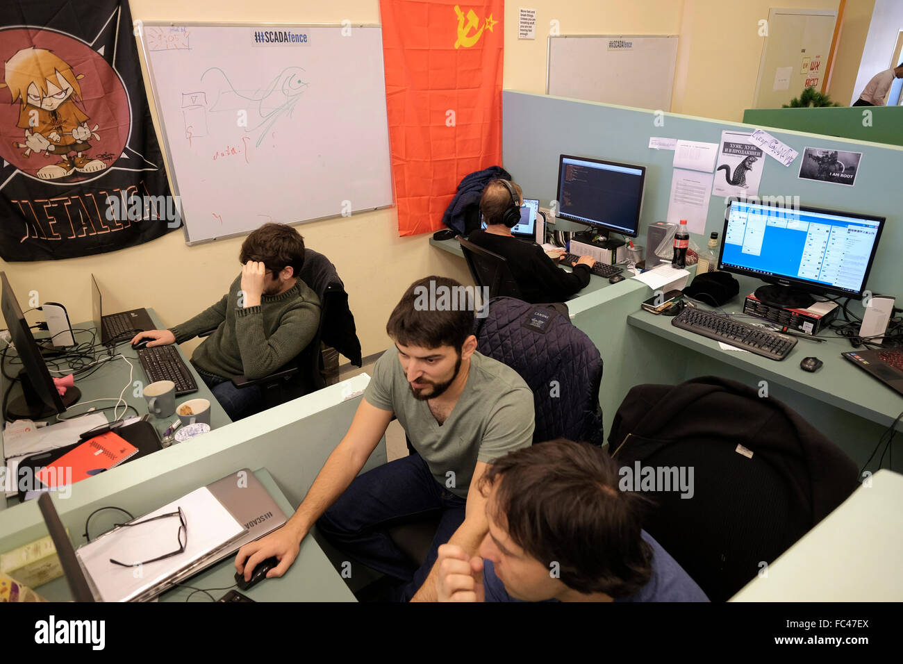 Employees working on computers in cubicles at JVP Cyber Labs a venture ...