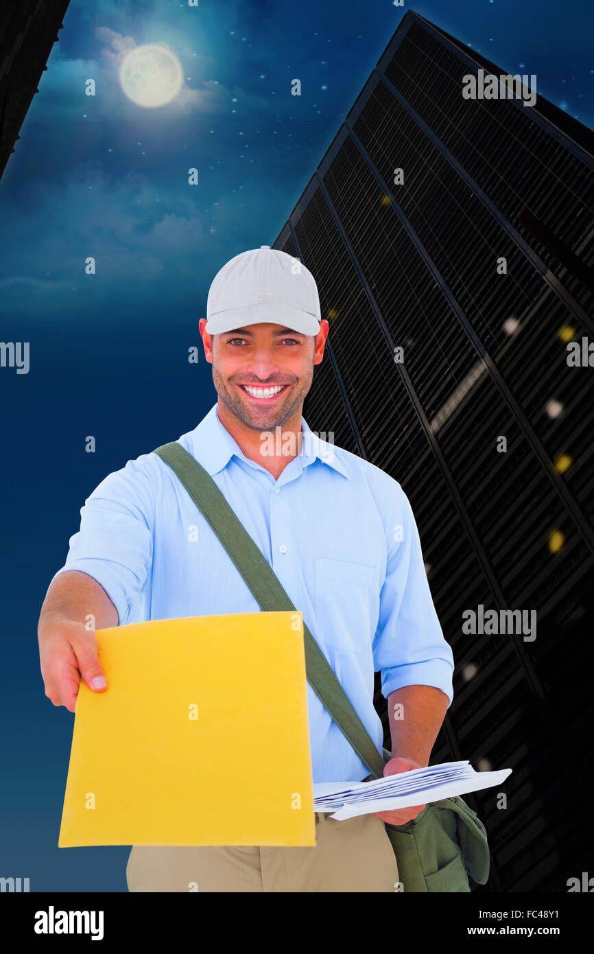 Composite image of portrait of postman delivering letter Stock Photo ...