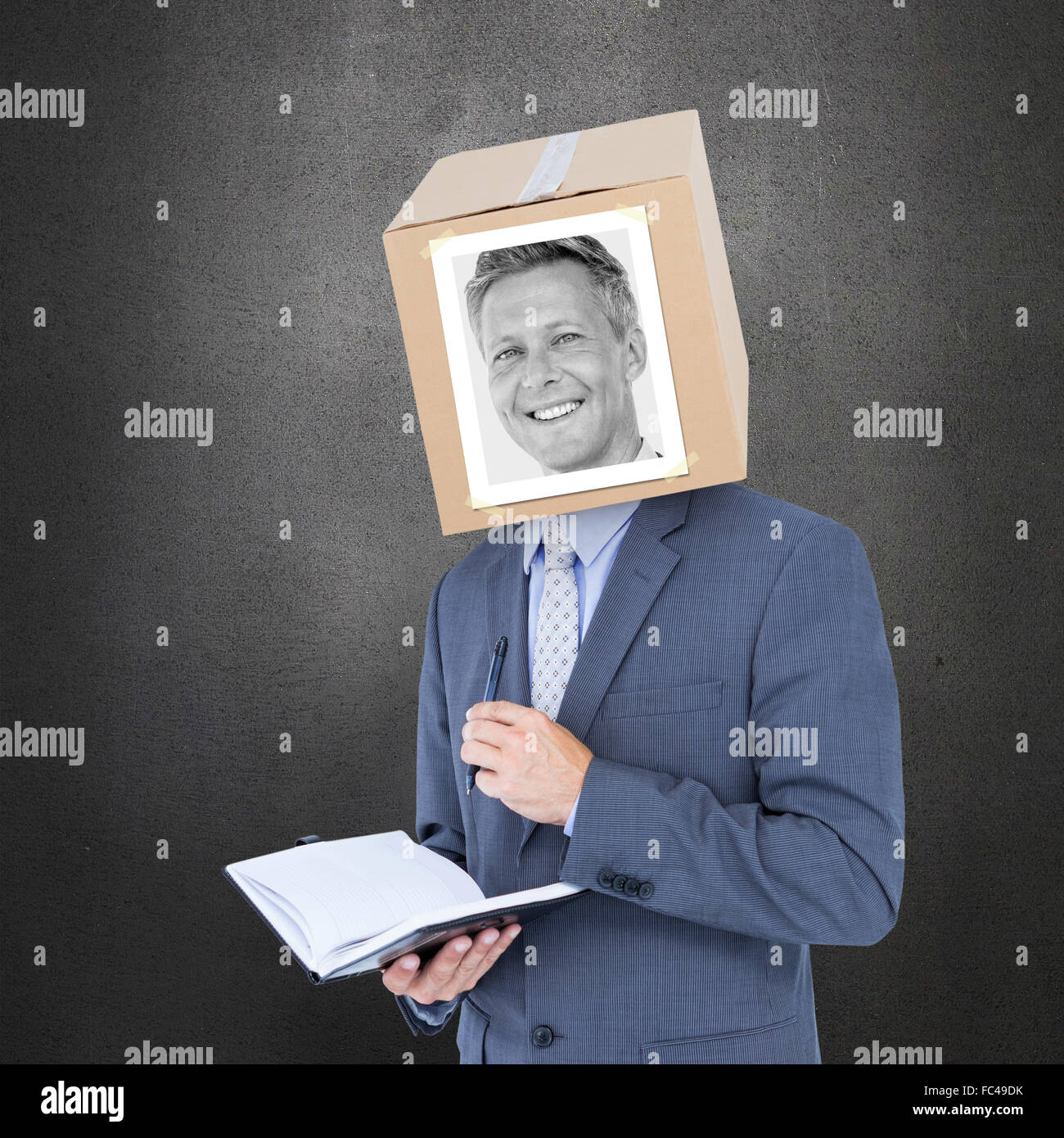 Composite image of businessman with photo box on head Stock Photo - Alamy