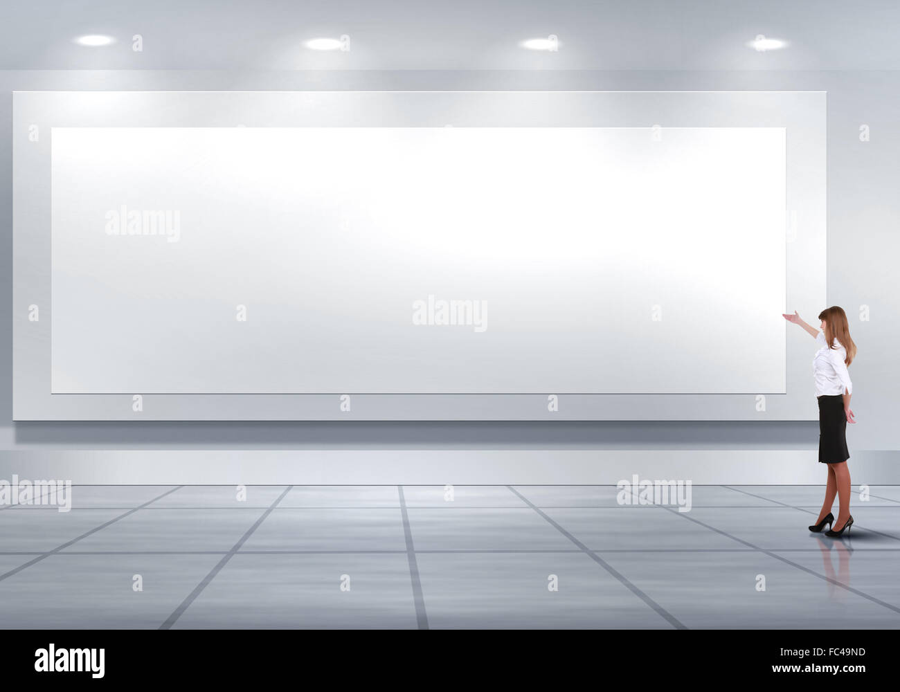 Business person standing near a blank billboard Stock Photo - Alamy