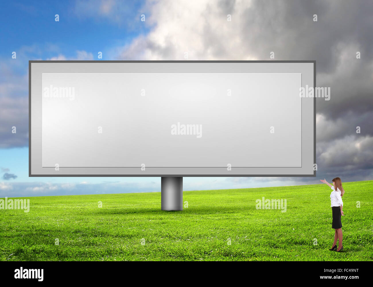 Business person standing near a blank billboard Stock Photo - Alamy