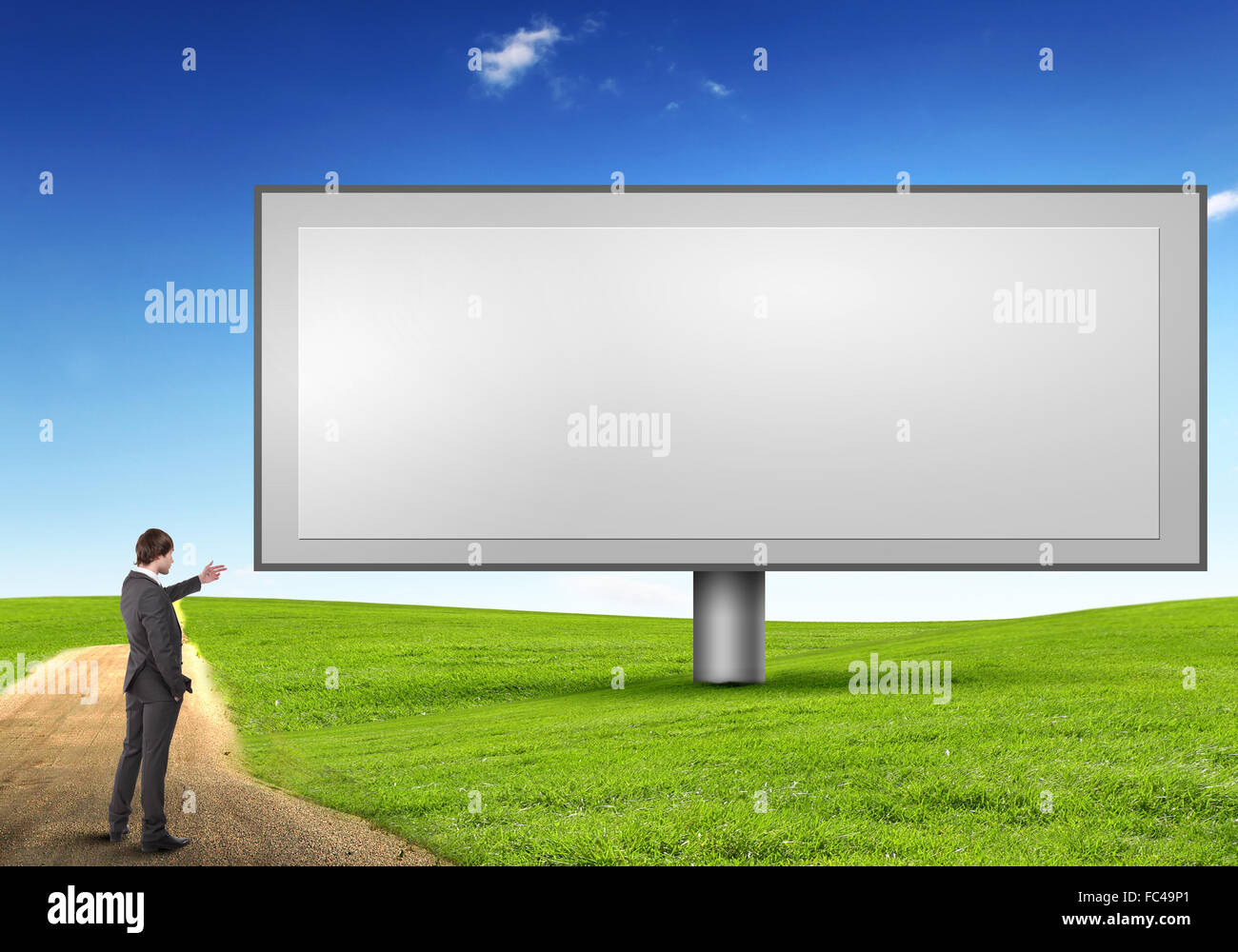 Business person standing near a blank billboard Stock Photo - Alamy