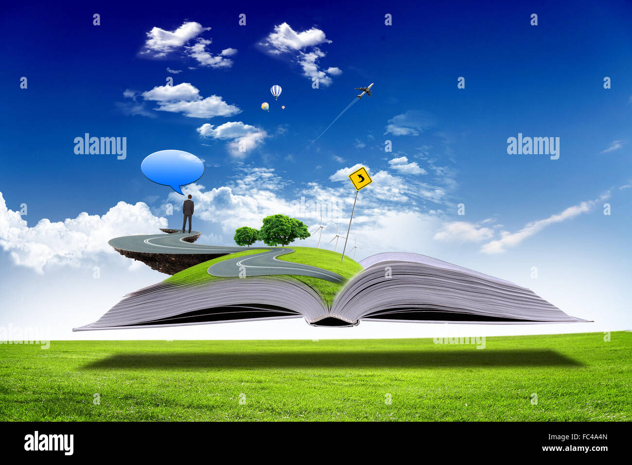 Open book with green nature world coming out of its pages Stock Photo ...