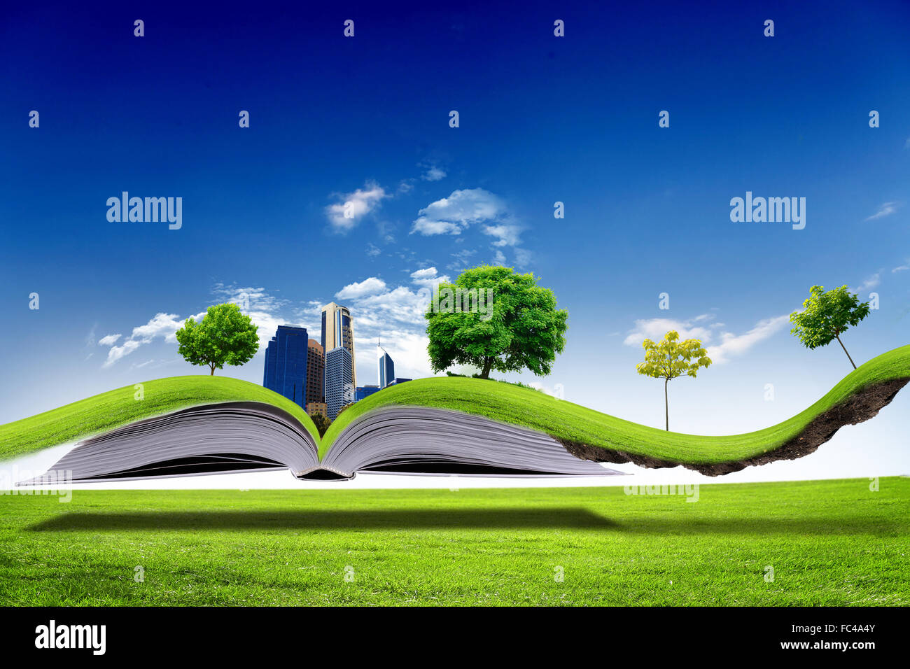 Open book with green nature world coming out of its pages Stock Photo ...