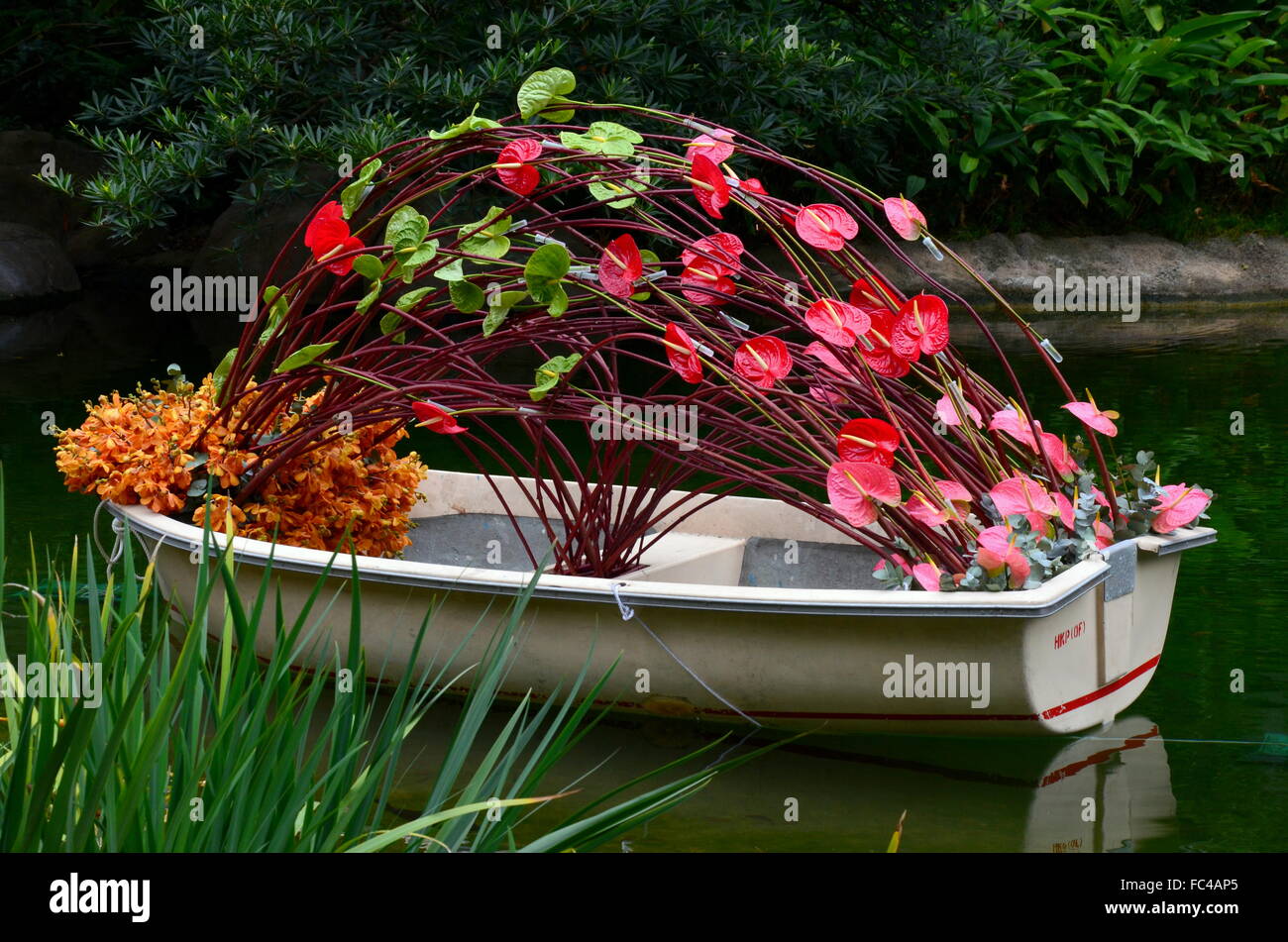 Flowers in boat Stock Photo - Alamy