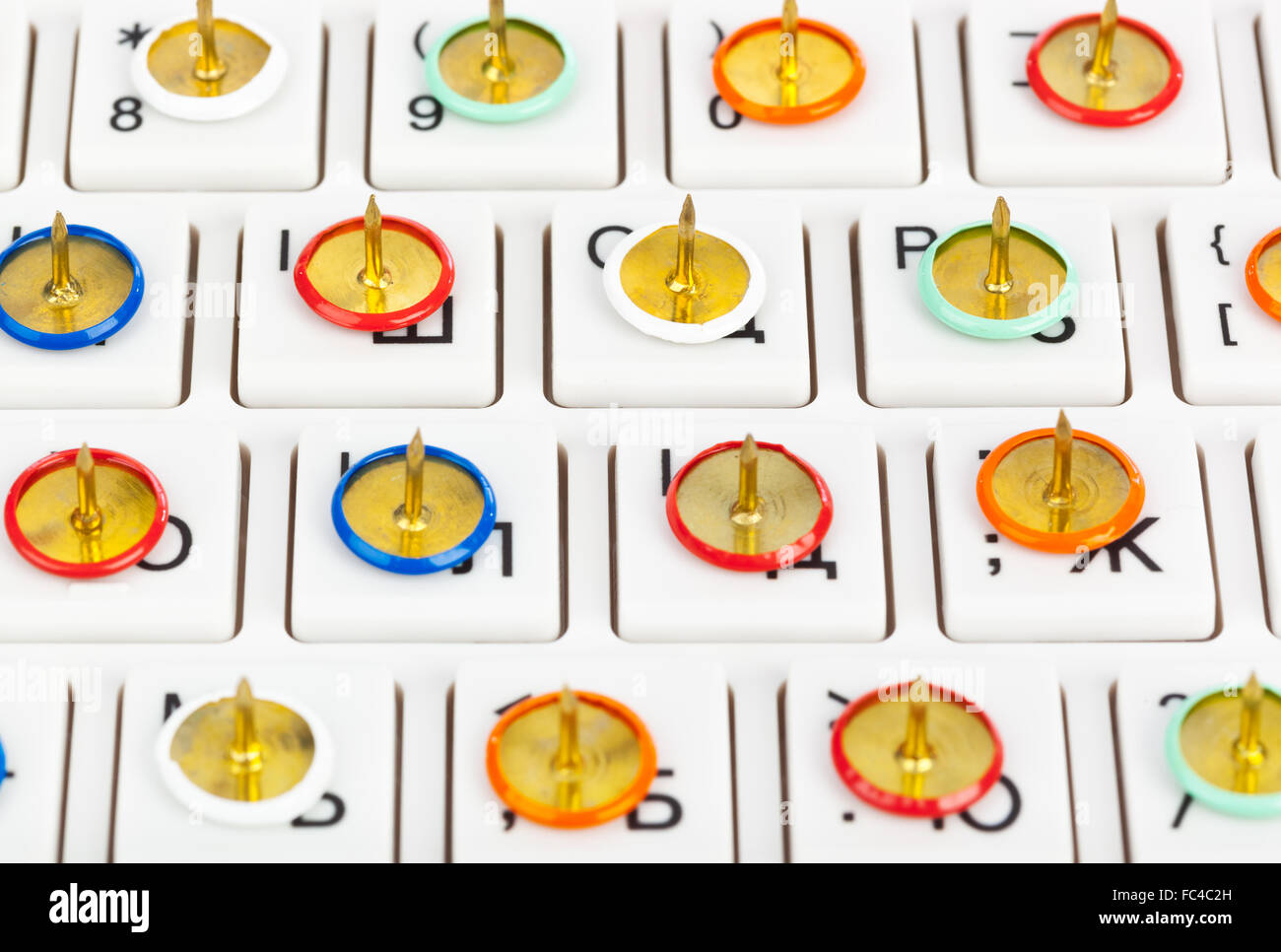 Pins on computer keyboard Stock Photo - Alamy
