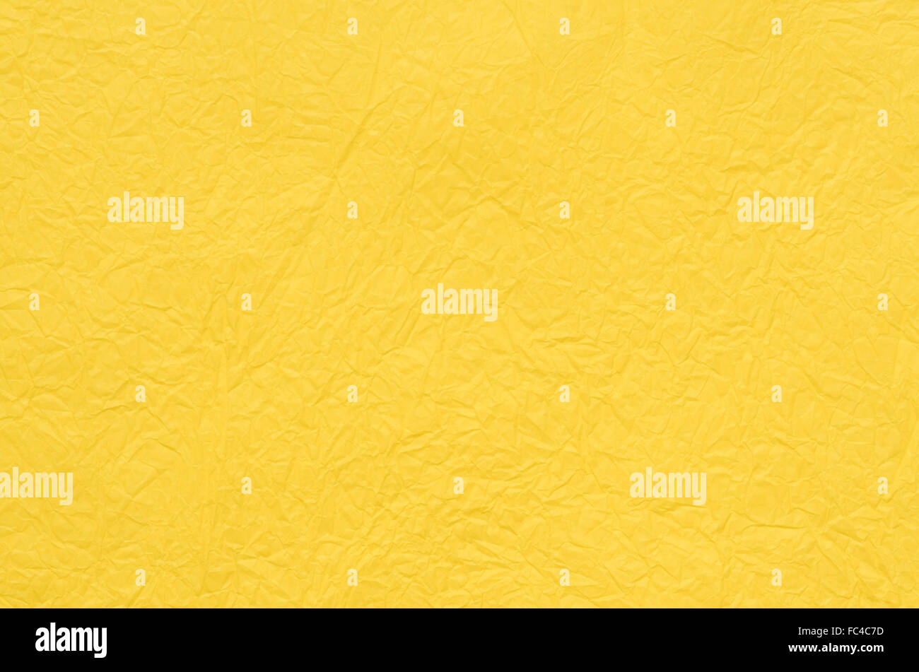 yellow creased tissue paper background texture Stock Photo - Alamy