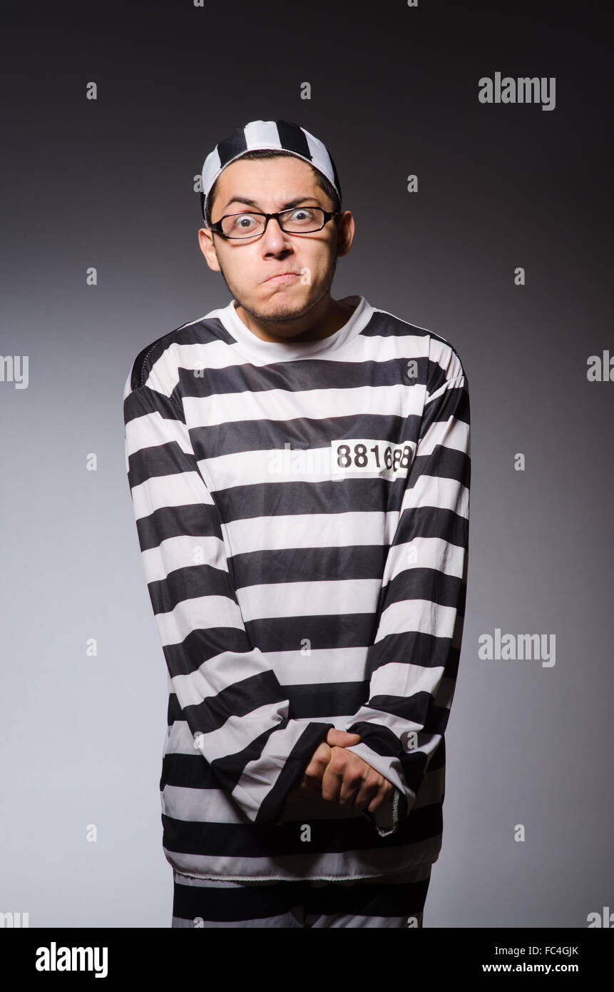 Funny prisoner isolated on gray Stock Photo - Alamy