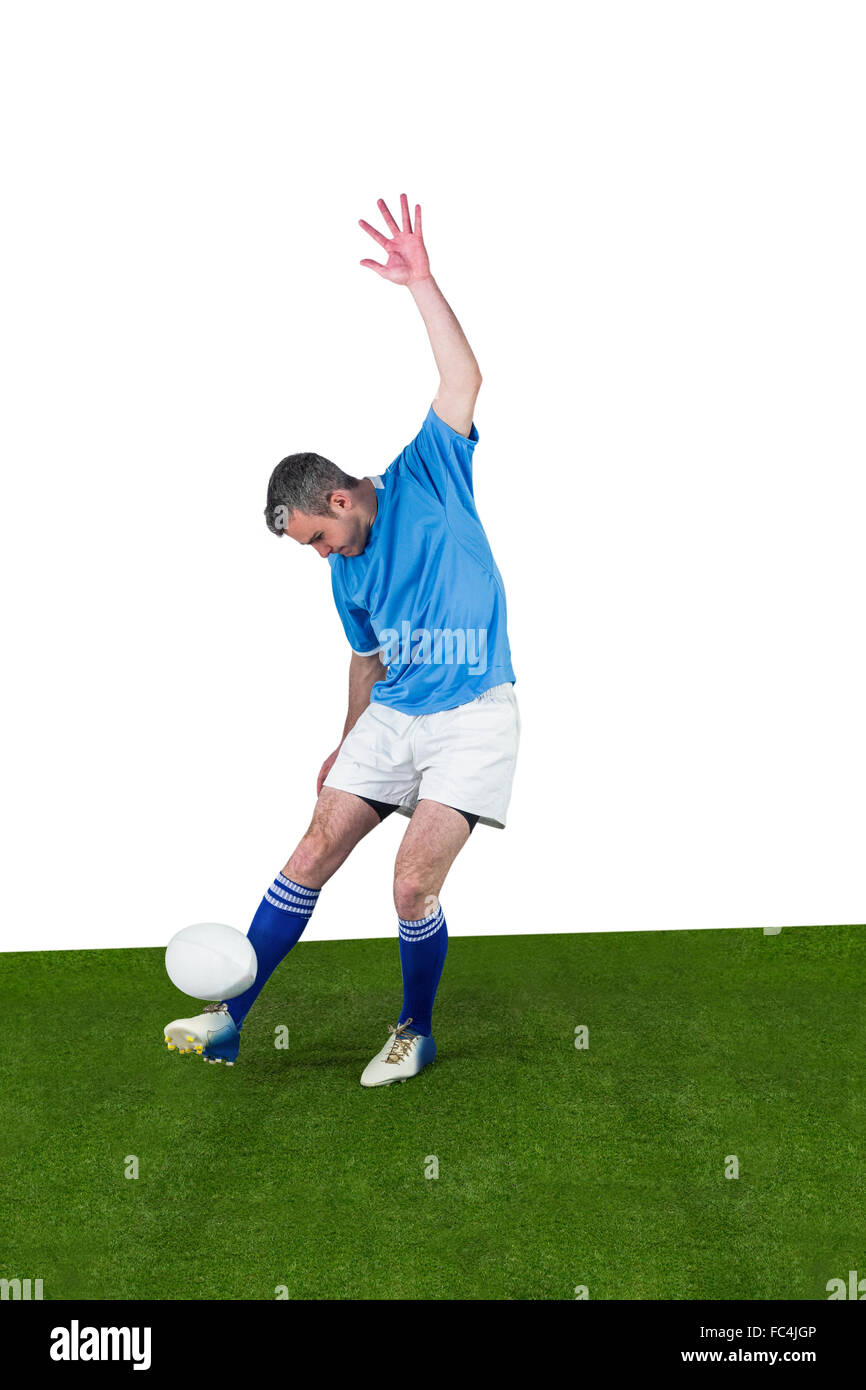 Rugby player kicking a rugby ball Stock Photo - Alamy
