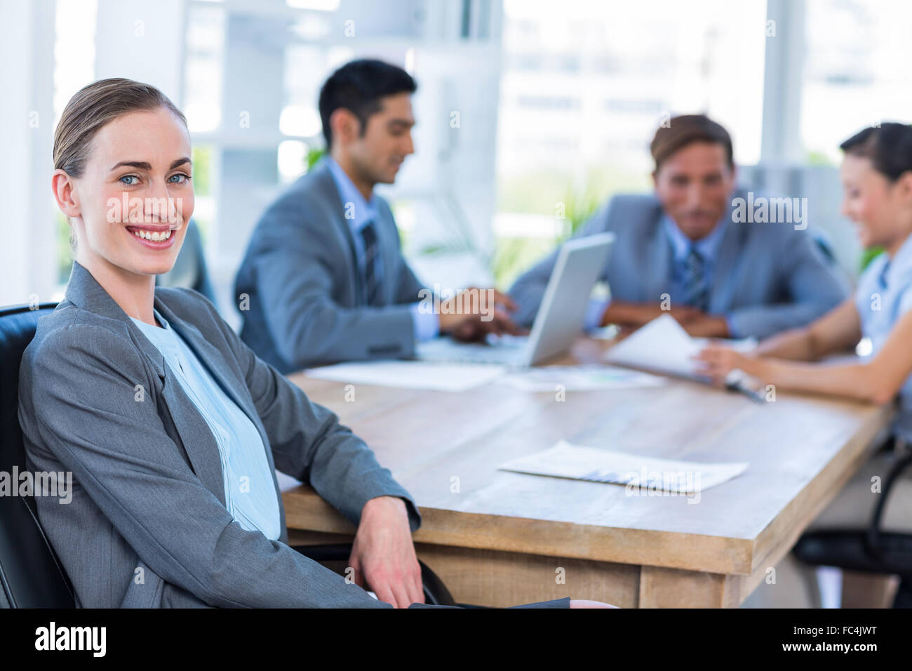 Business people speaking together during meeting Stock Photo - Alamy