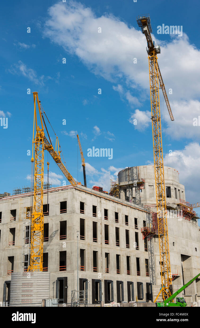 Construction cranes on a building site Stock Photo - Alamy