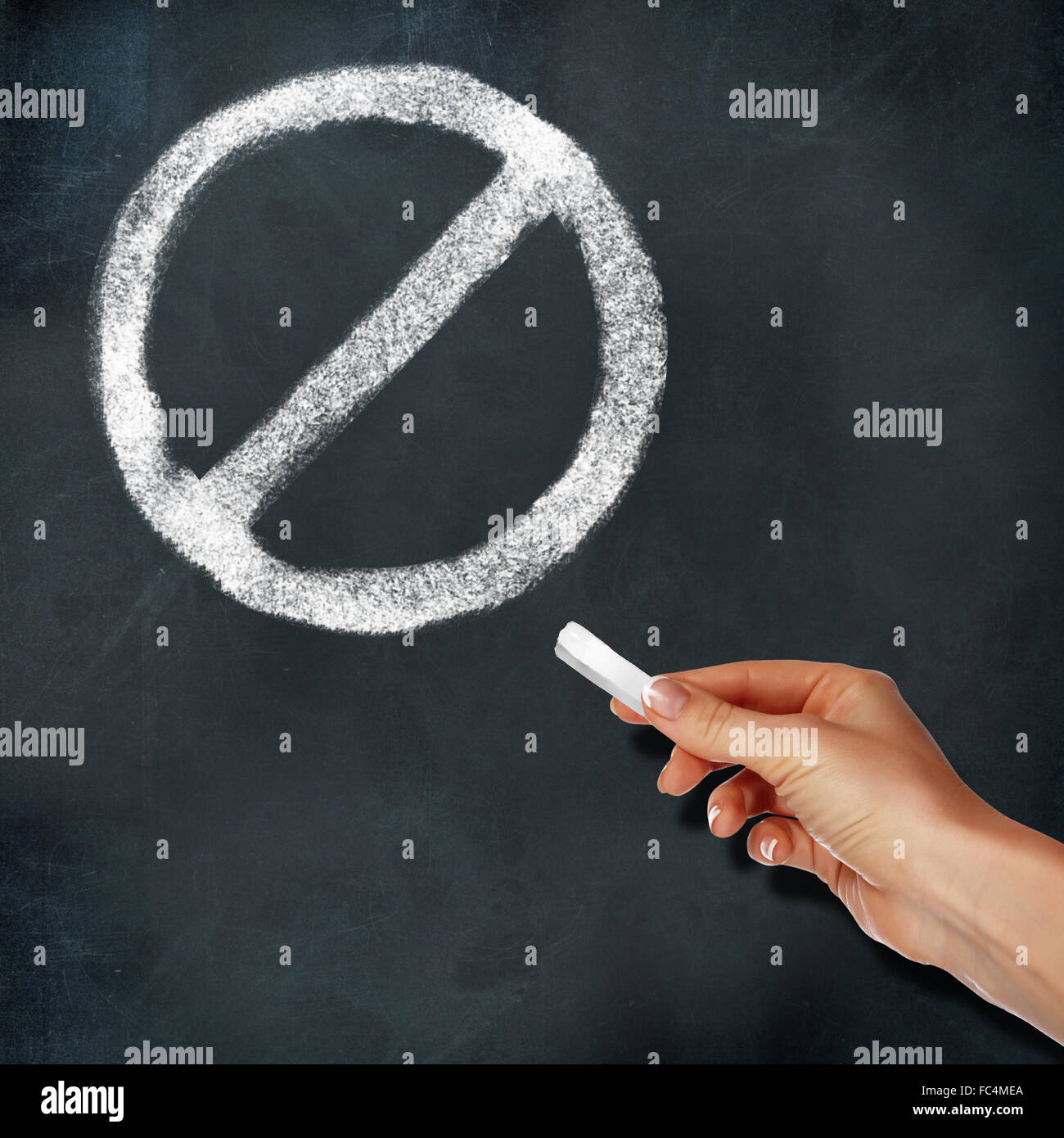 School blackboard and hand with chalk drawing stop symbol Stock Photo ...