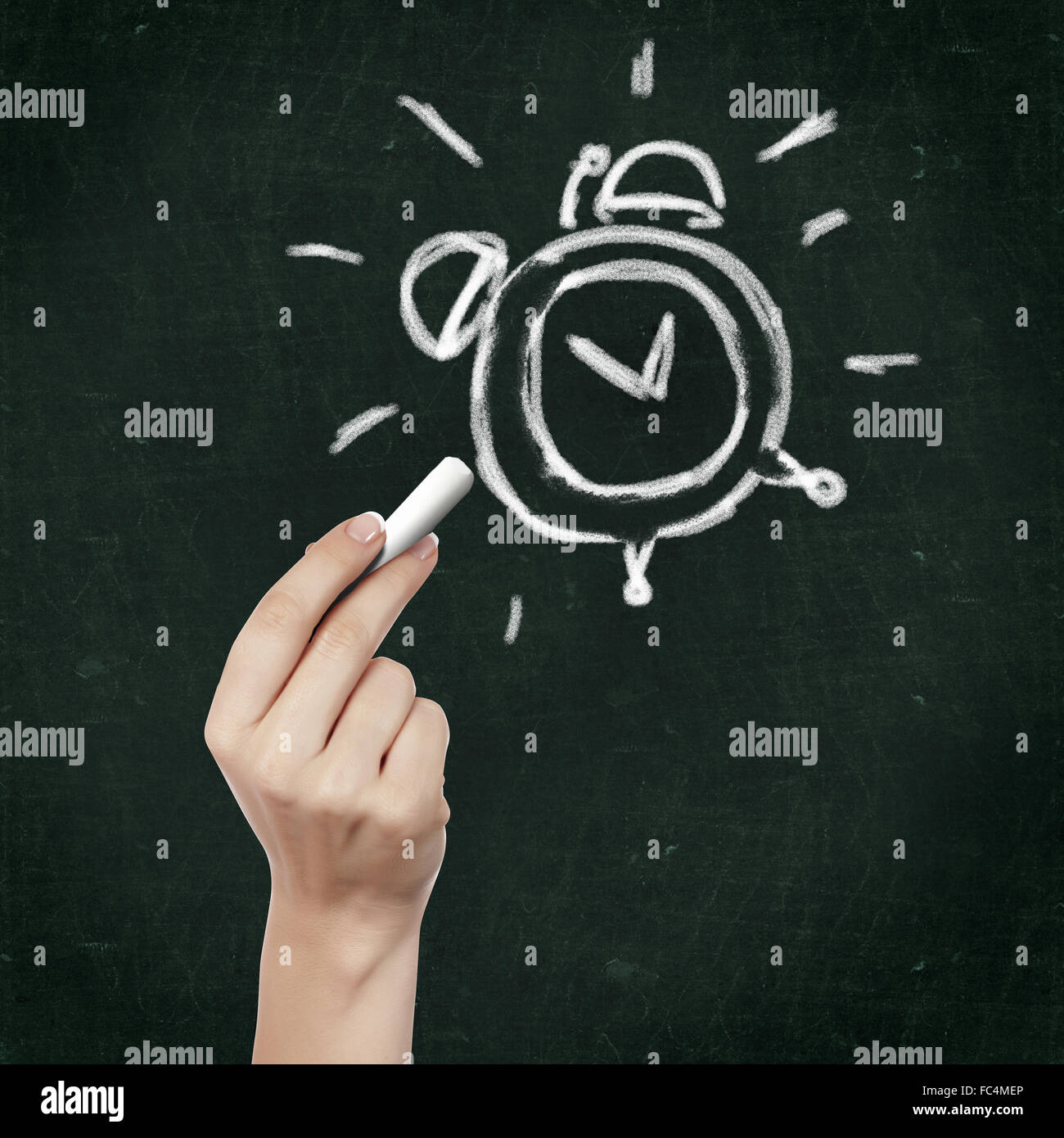School blackboard and hand with chalk drawing alarm clock Stock Photo ...