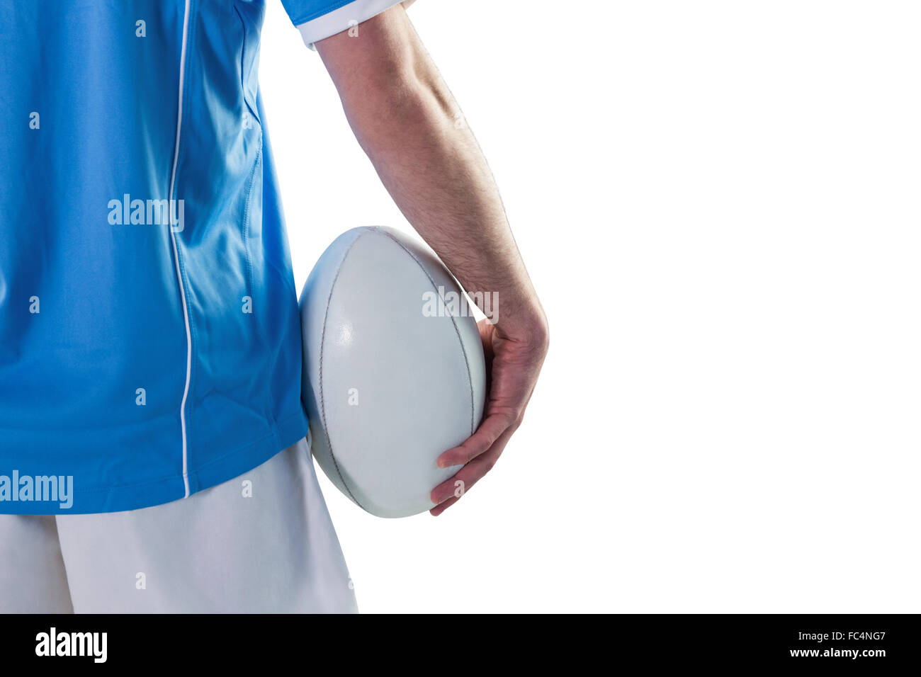 Rugby player holding a rugby ball Stock Photo - Alamy