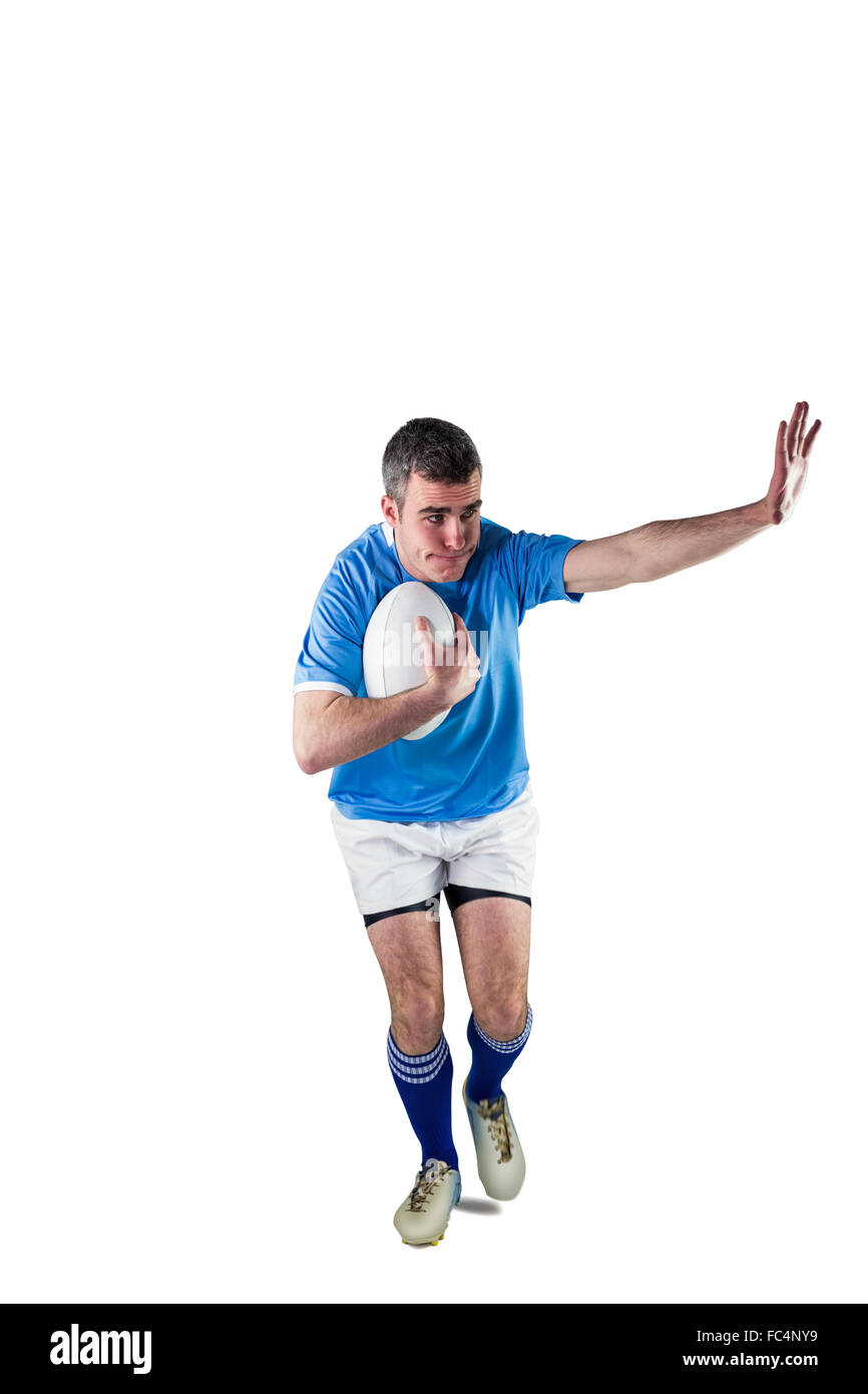Rugby player running with the rugby ball Stock Photo - Alamy