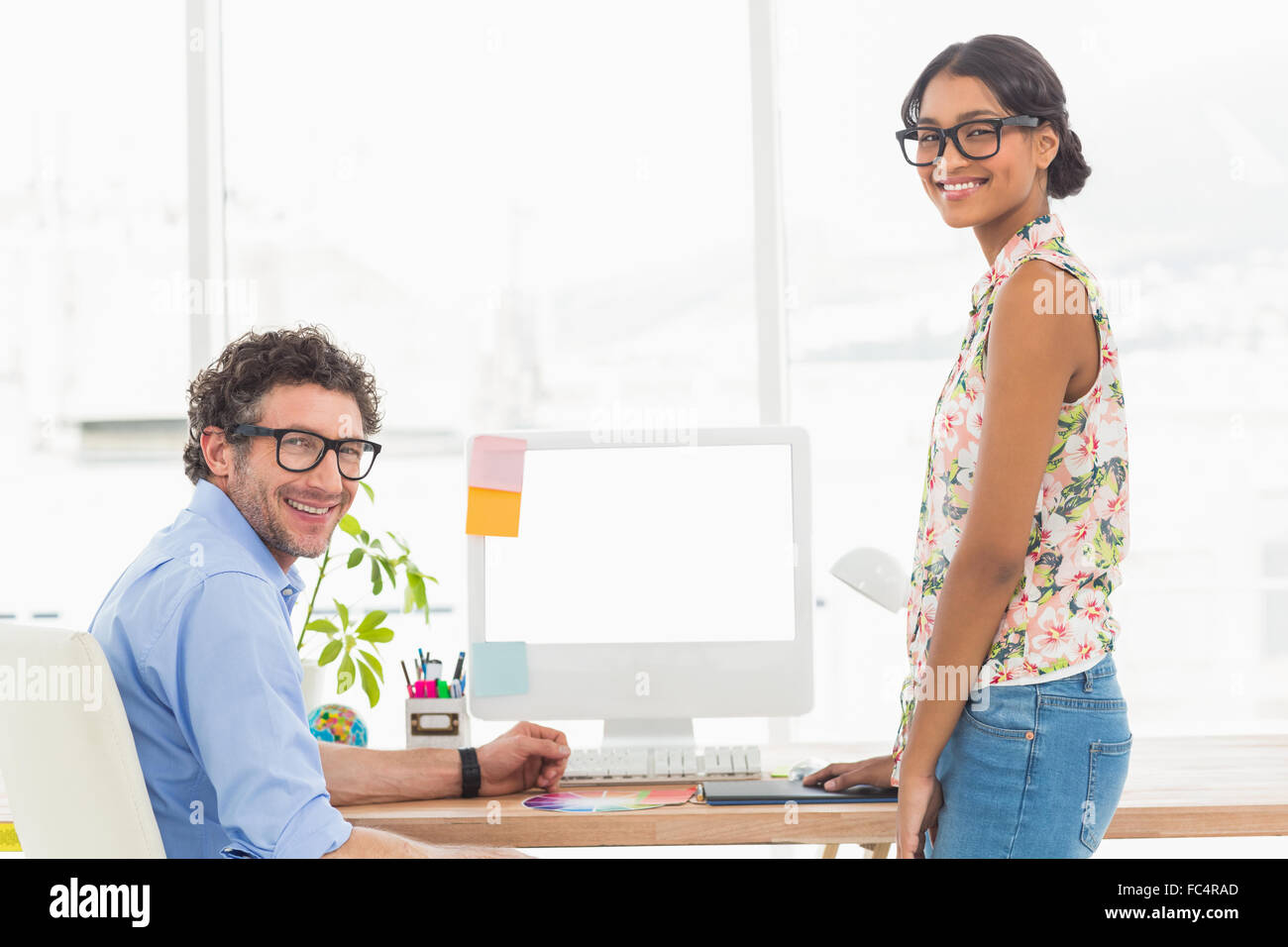 Portrait of smiling partners posing together Stock Photo - Alamy