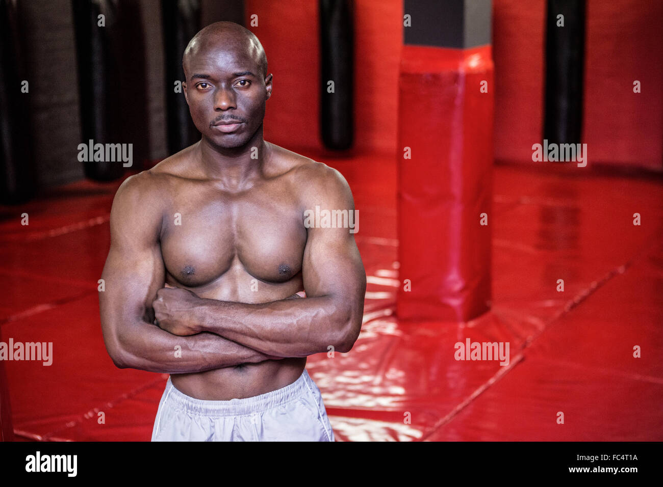 Young Bodybuilder posing in front of the camera Stock Photo - Alamy